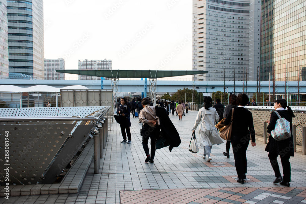 Japanese people and foreigners worker walking go to trains and bus ...