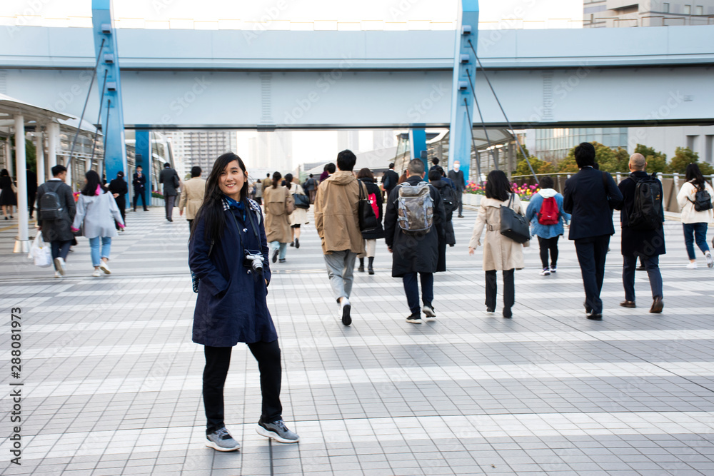 Thai women and Japanese people and foreigners walking go to trains ...