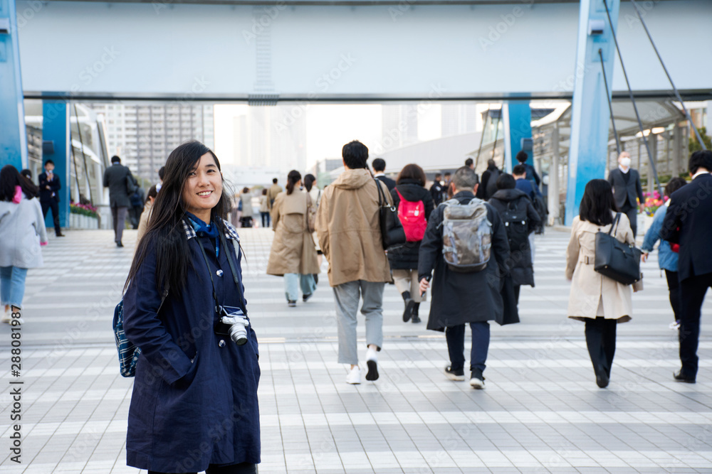 Thai women and Japanese people and foreigners walking go to trains ...