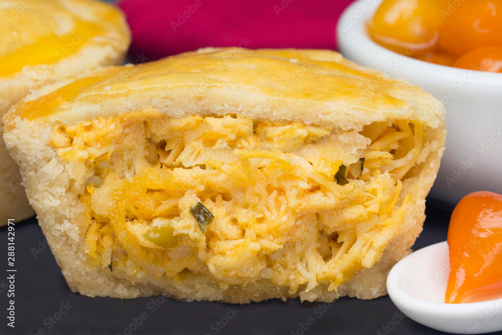 Cut Traditional Brazilian mini chicken pie called empada with pepper ...