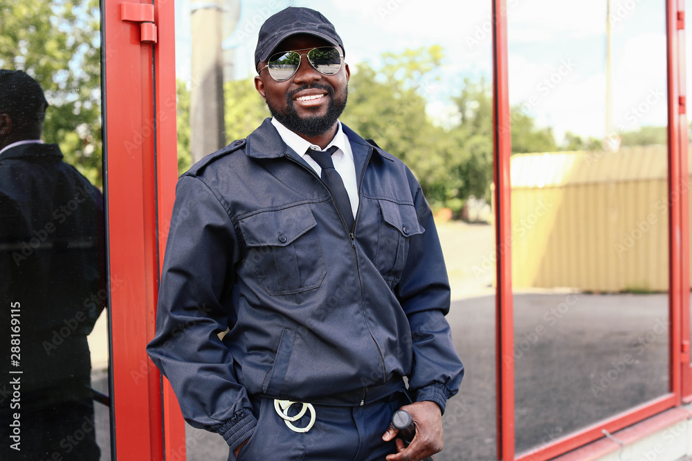 African-American security guard outdoors Stock Photo | Adobe Stock