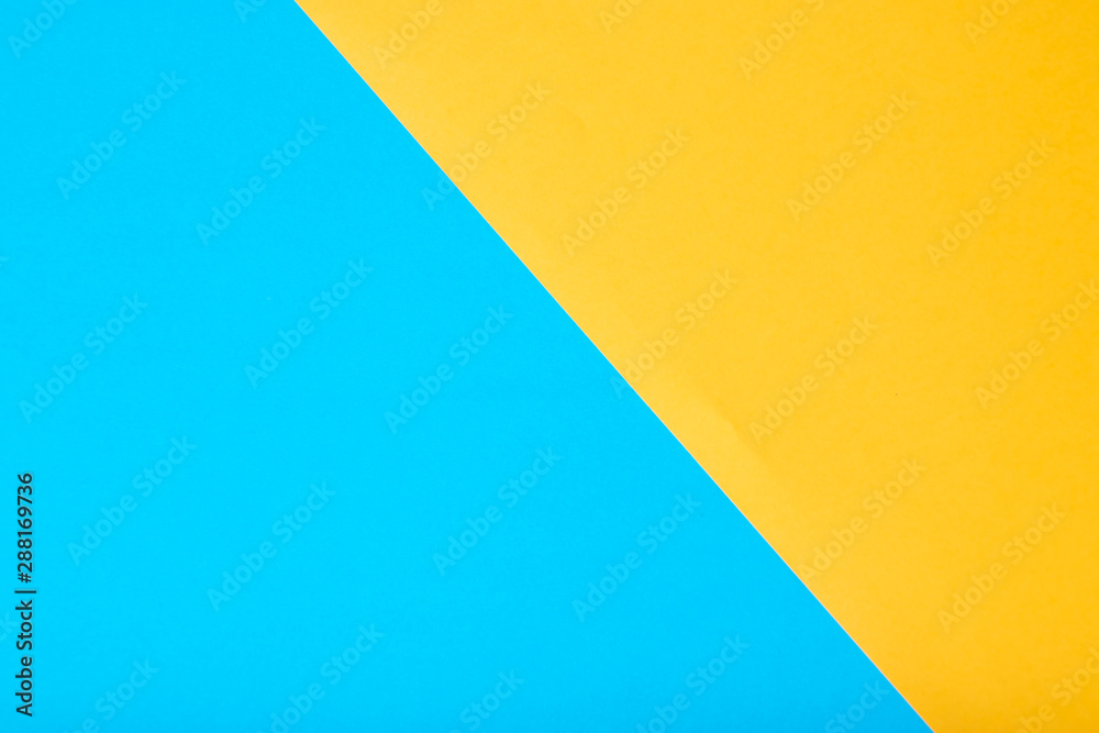 Yellow and blue two tone color paper background. Stock Photo | Adobe Stock