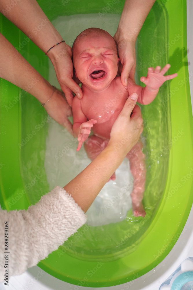 Newborn bath Stock Photo | Adobe Stock