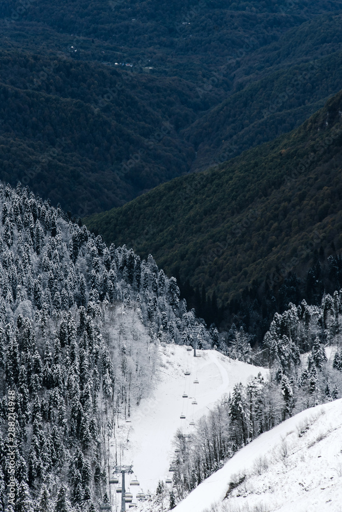 Beautiful valley of snowy mountains with ski resort Stock Photo | Adobe ...