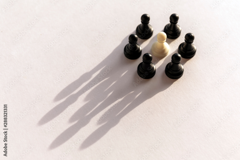 Plastic chess pawn circle with shadow shaped as crown on white ...
