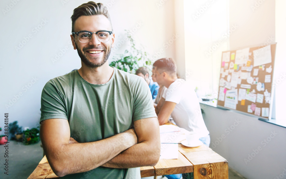 Handsome young business man in smart casual wear on background of ...