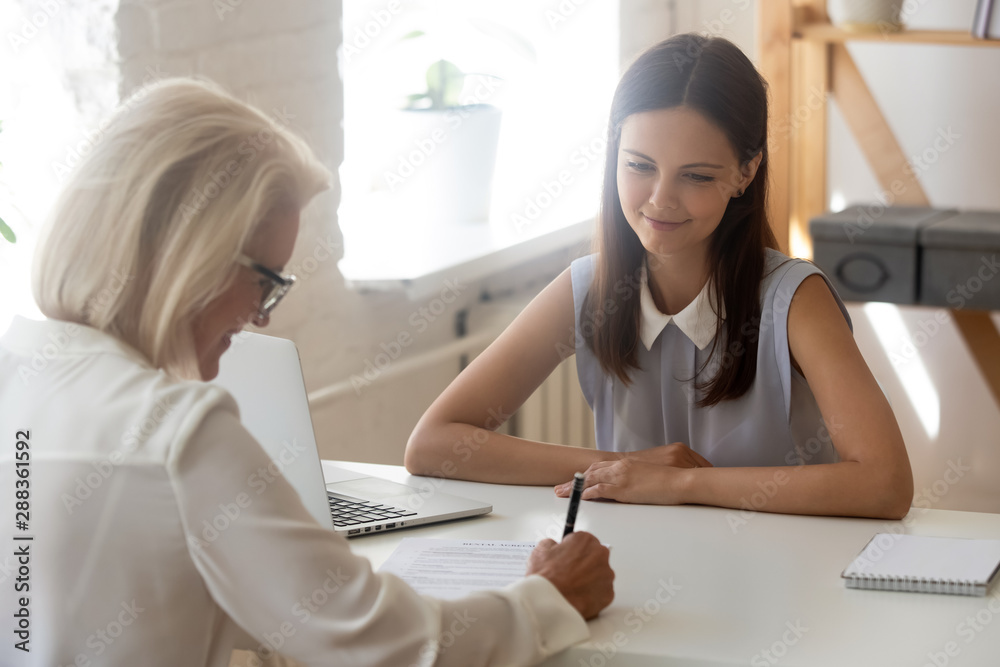 Woman client sign official document at bank specialist office Stock ...