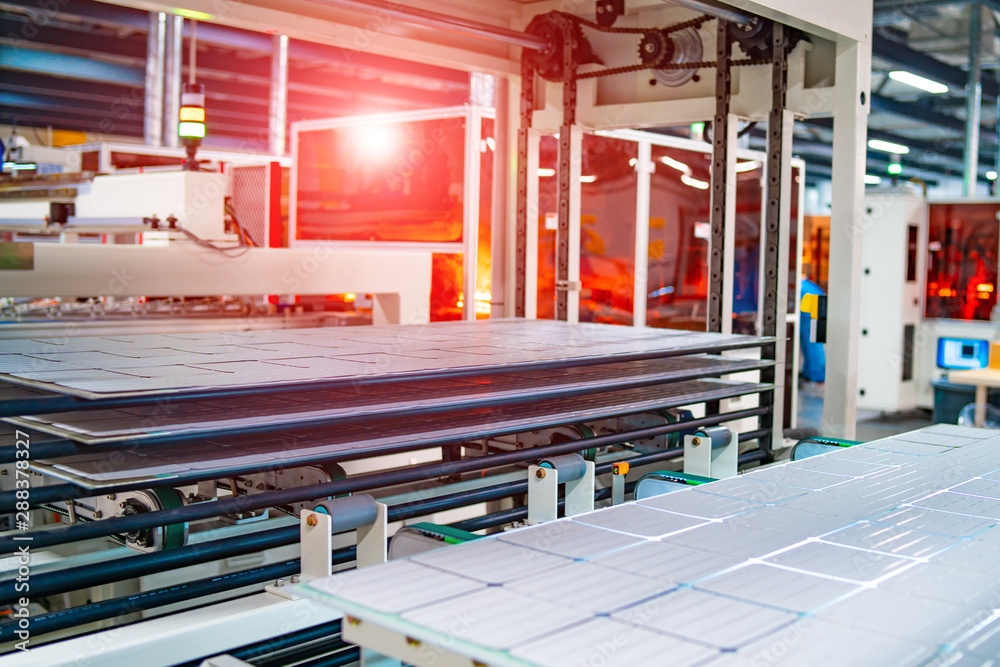 Manufacturing of solar panel system in factory. Automated industrial ...