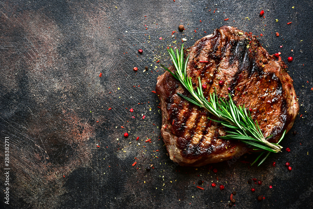 Roasted beef steak. Top view with copy space. Stock Photo | Adobe Stock