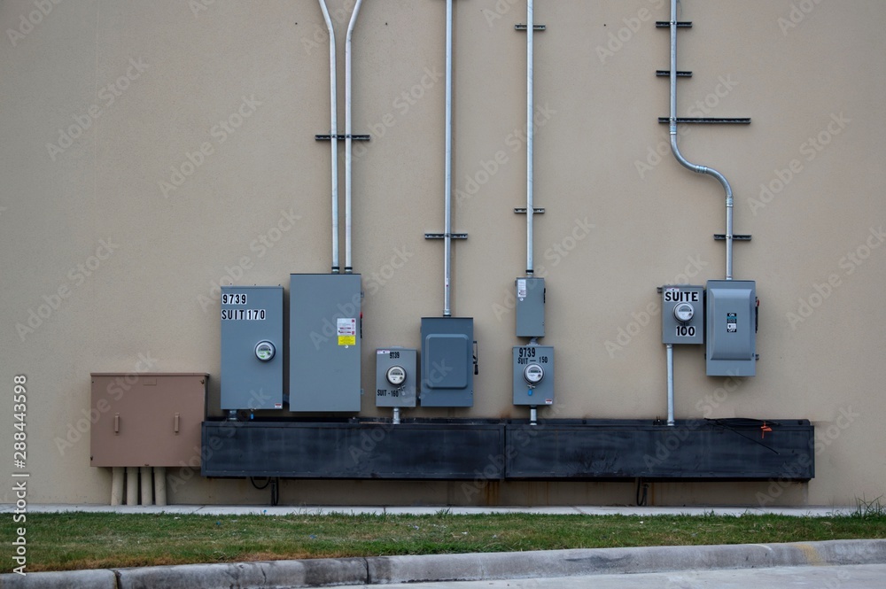 Power boxes on the side of a business in a strip mall in Humble, Texas ...