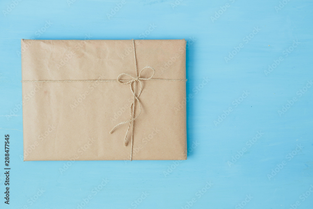 Overhead view of a single holiday package wrapped with eco friendly ...