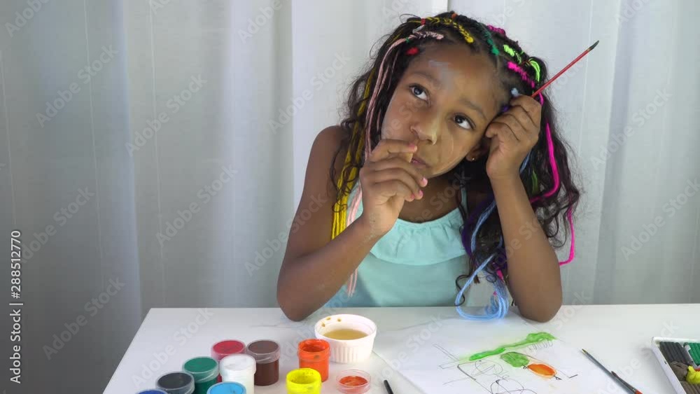 Jamaican mixed ethnicity girl with colored braids and colored face with ...