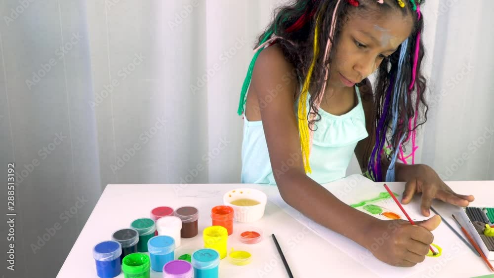 Jamaican mixed ethnicity girl with colored braids and colored face ...