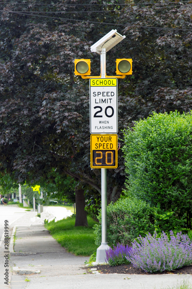 FLASHING DIGITAL SCREEN SPEED LIMIT SIGN in a school zone street Stock ...