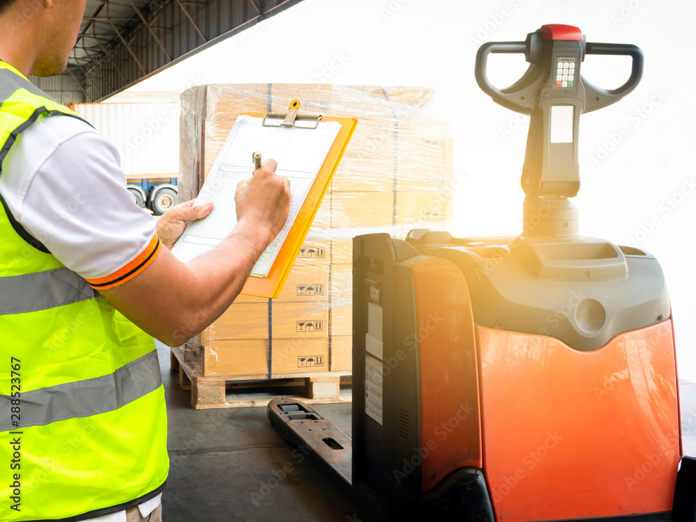 Worker Courier Doing Inventory Management of Cargo in the Warehouse ...