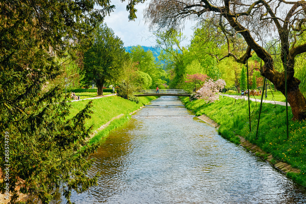 Bridge above river at Gonneranlage Kurpark in Old city of Baden Baden ...