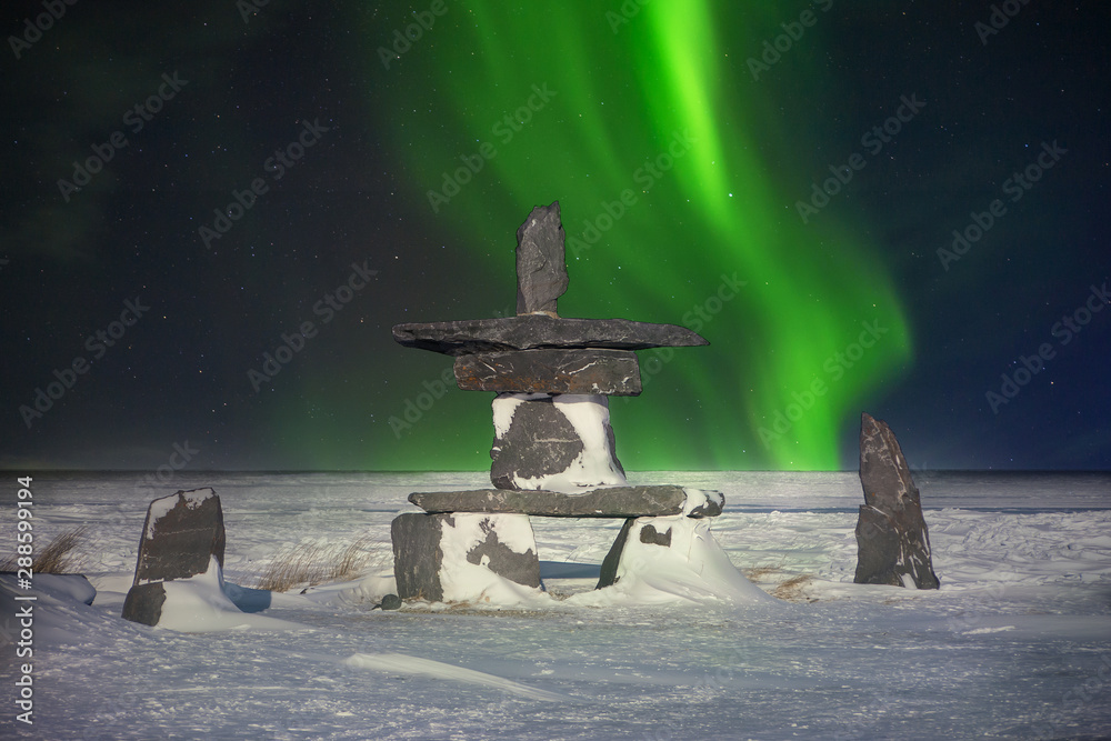 Poster A traditional stone inukshuk, an Inuit cultural symbol used as a ...
