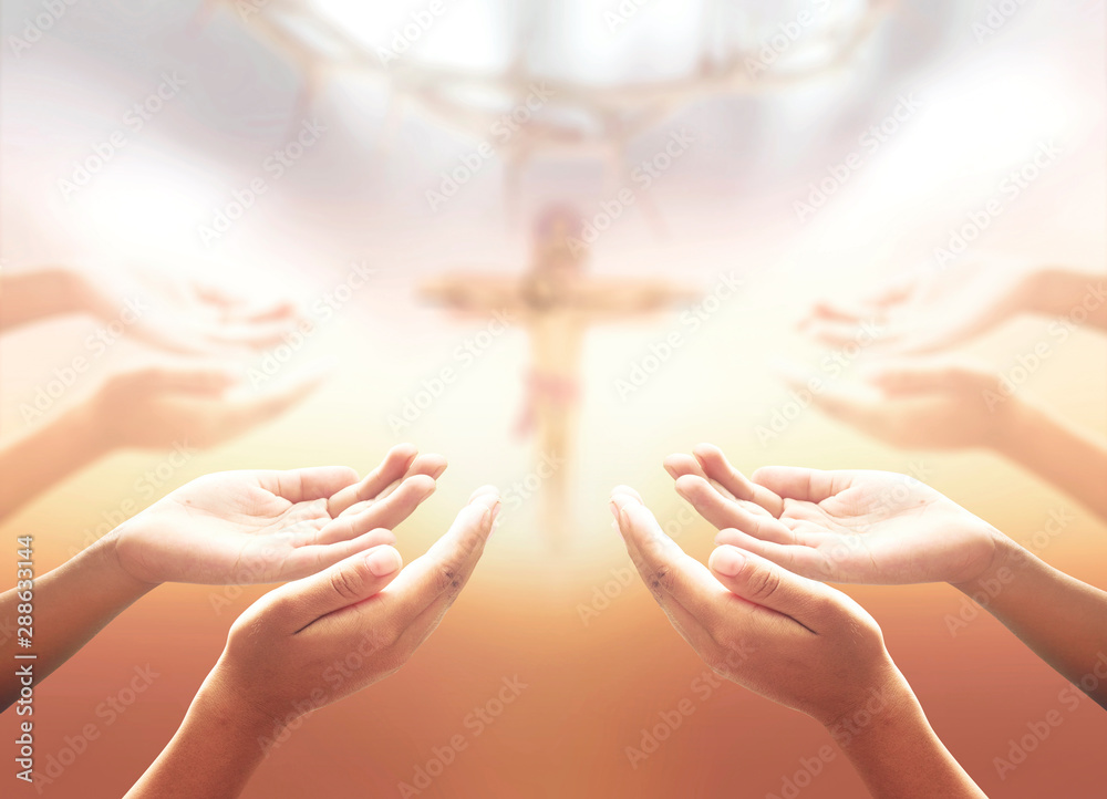 Many people hands praying together over blurred crown of thorns and ...