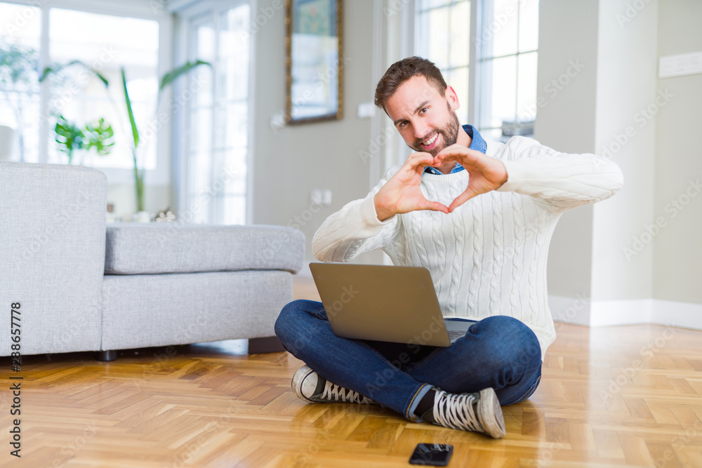 Handsome man wearing working using computer laptop smiling in love ...