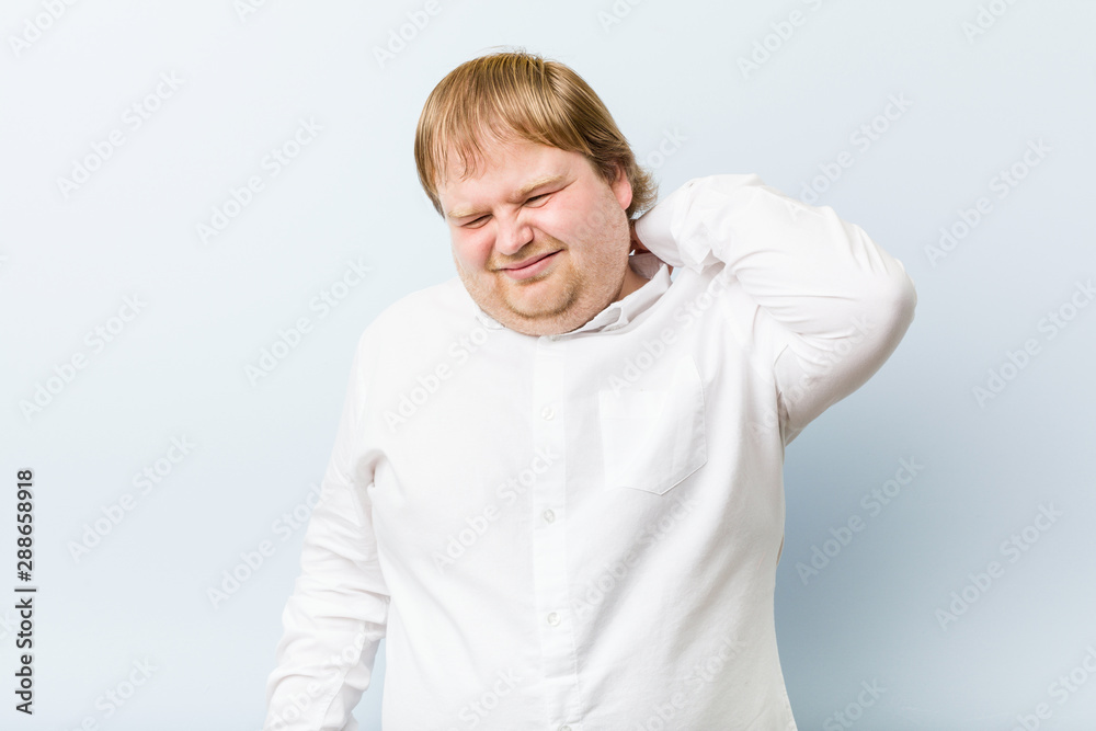 Young authentic redhead fat man suffering neck pain due to sedentary ...