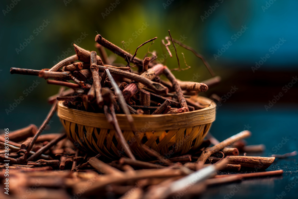 Bunch of Indian madderwort or madder root in a brown basket on the ...