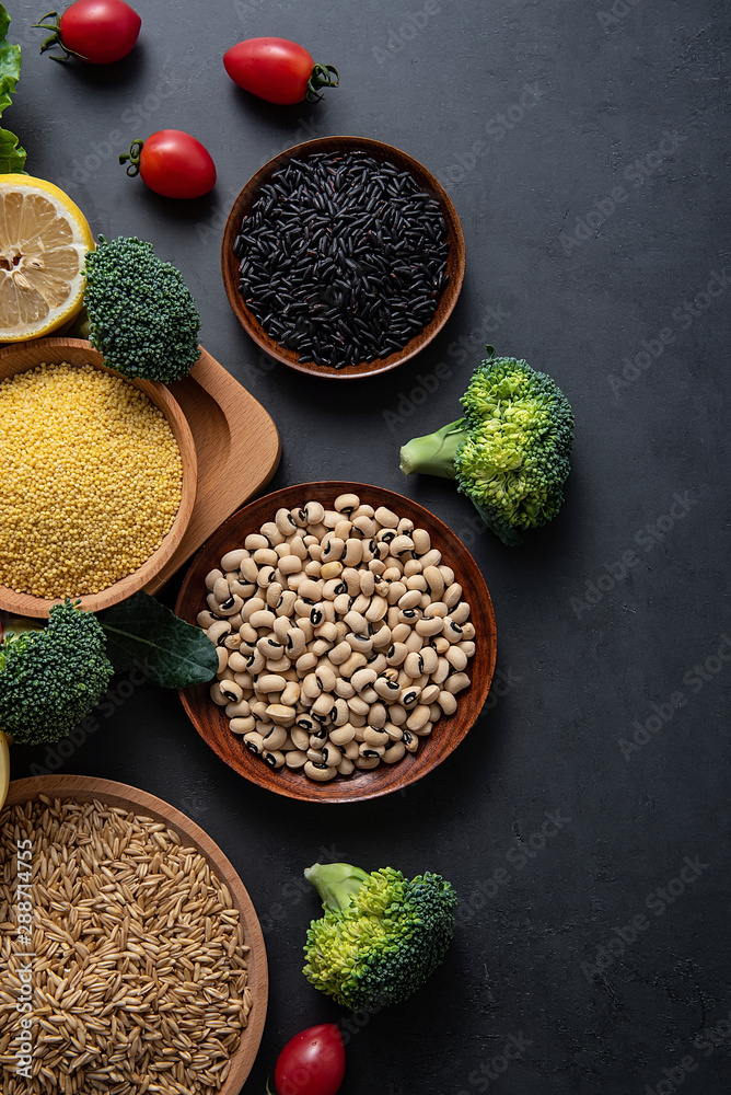 Bunch of fresh seasonal fruits, vegetables and grains of legumes on a ...