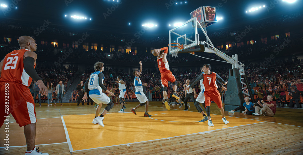 Basketball players on big professional arena during the game. Tense ...