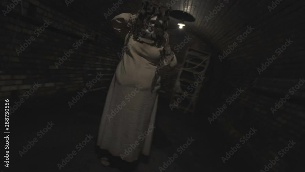 Vidéo Stock A scary ghost of a fat woman with a rusty cage on his head ...