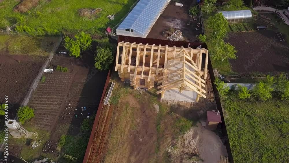 Plot with construction of wooden house. Clip. Top view on frame of ...