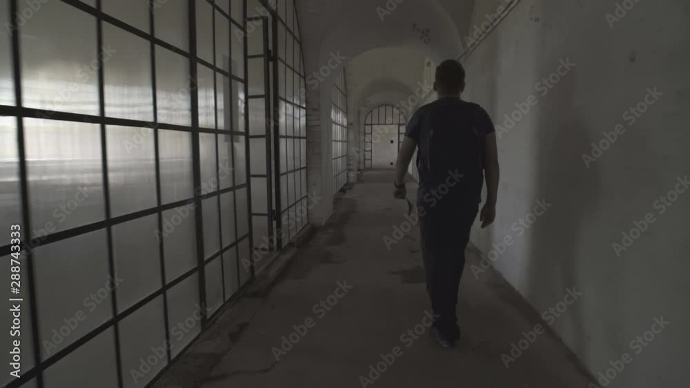 A scary ghost of a fat woman with a rusty cage on his head and with ...