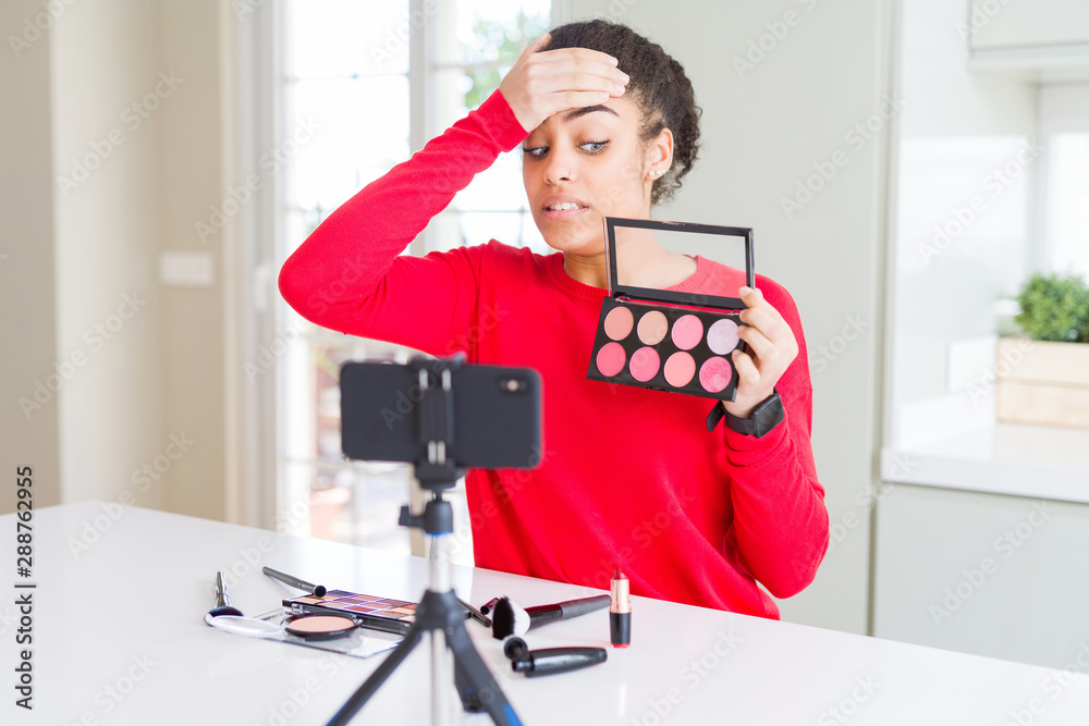 Young african american influencer woman recording make up tutorial ...