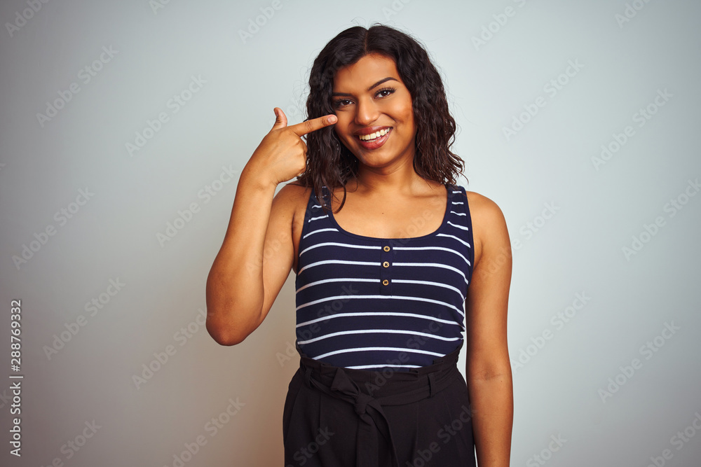 Transsexual transgender woman wearing striped t-shirt over isolated ...