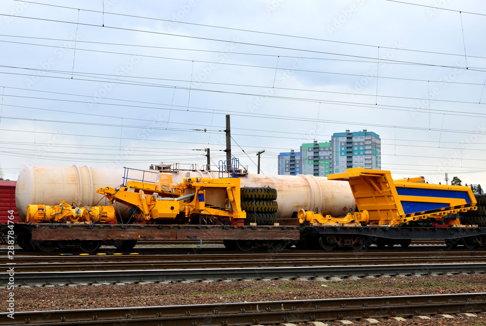 Logistics transportation heavy mining dump truck by rail. Yellow mining ...
