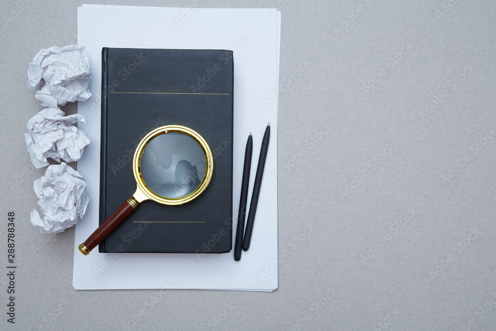 Magnifying glass, book and crumpled paper. FAQ, Q and A and SEO ...