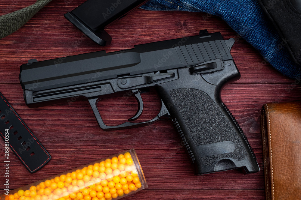 BB Gun, Old Airsoft Pistol Toy and Magazine with BB Gun Bullets on Wood ...