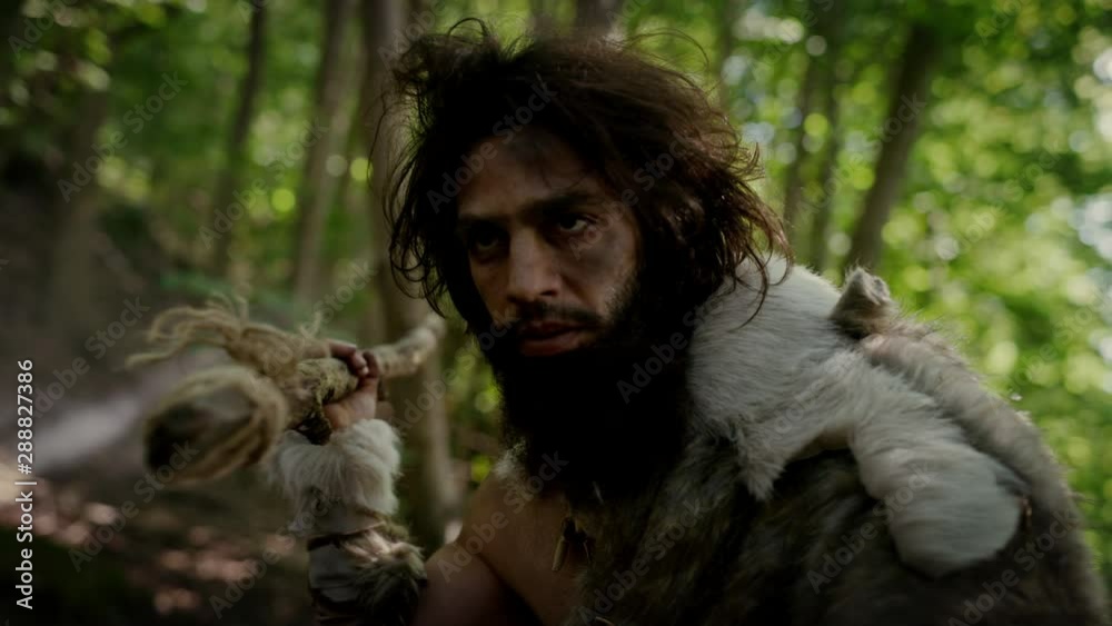 Vidéo Stock Close-up Portrait of Primeval Caveman Wearing Animal Skin ...