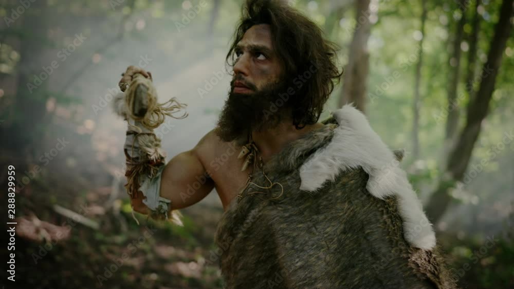 Vidéo Stock Portrait of Primeval Caveman Wearing Animal Skin and Fur ...