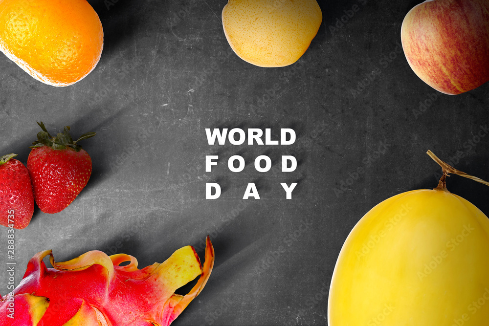Various kinds of fruit with World Food Day text on black background ...