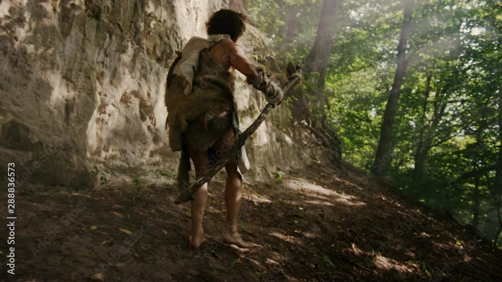 Vidéo Stock Primeval Caveman Wearing Animal Skin Holds Stone Tipped ...