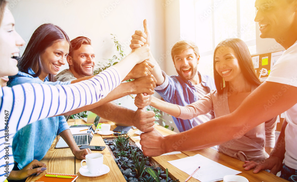 Group of happy, excited and successful modern people in office. Start ...