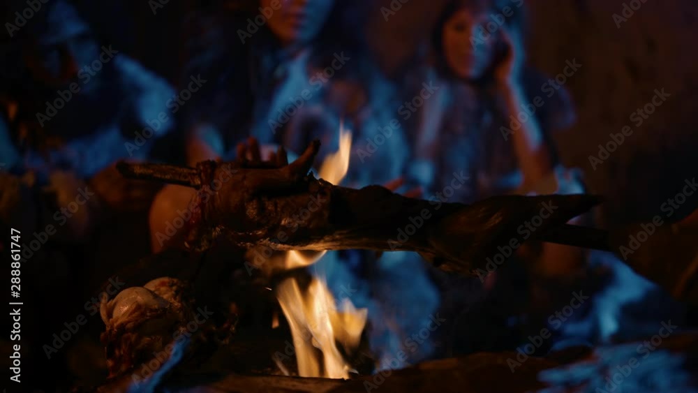 Neanderthal or Homo Sapiens Family Cooking Animal Meat over Bonfire and ...