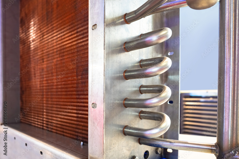 Radiator. Copper-aluminum heat exchanger. Capacitor close-up. Capacitor ...
