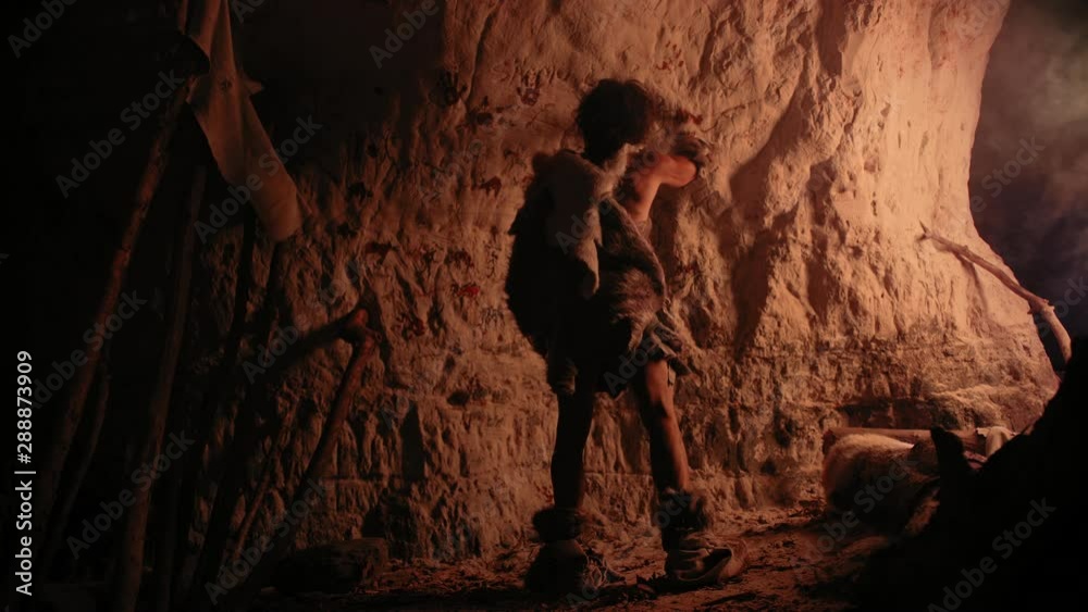 Primitive Prehistoric Neanderthal Wearing Animal Skin Draws Animals and ...