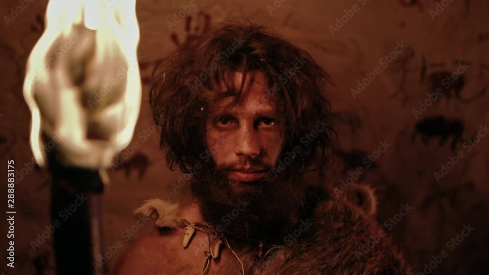 Portrait of Primeval Caveman Wearing Animal Skin Standing in His Cave ...