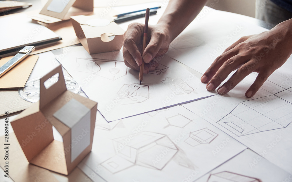 Designer sketching drawing design Brown craft cardboard paper product ...