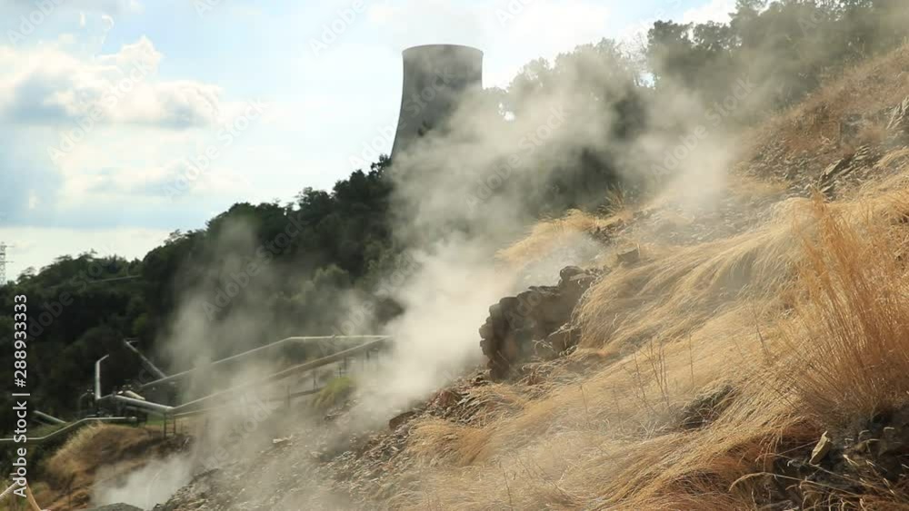 Geothermal field with fumaroles and steam pipes. Geothermal power ...