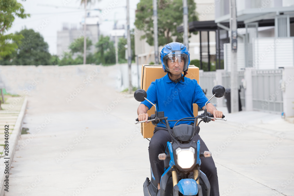 Courier delivering parcel box by motorcycle or scooter. Fast express ...