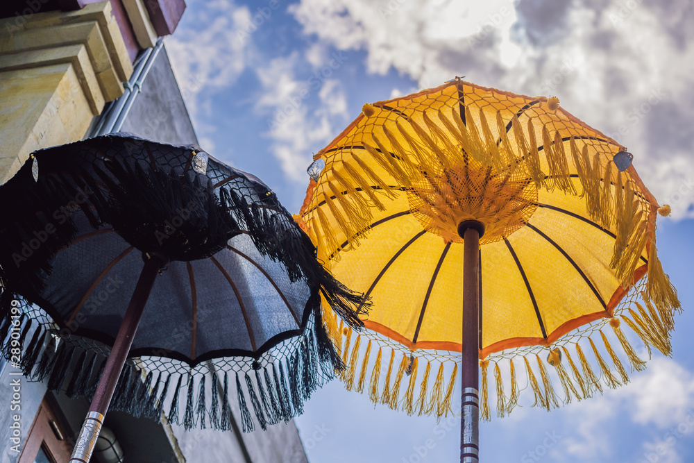 Typical Balinese umbrellas placed in the home temple Ubud, Bali ...