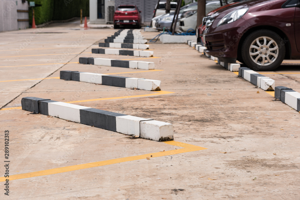 Car parking lane in the public park.Outdoor row of car parked at the ...