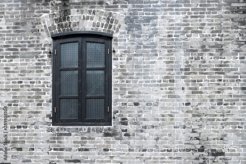 Traditional classic wood window and brick wall in ancient chinese house ...